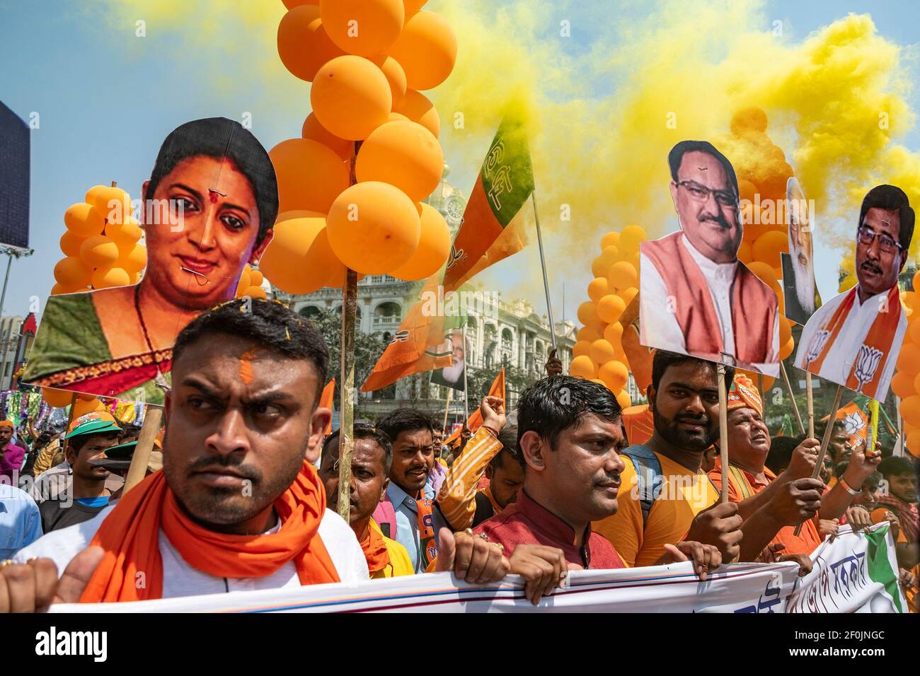 BJP supporters hold a banner during a mass rally.Bharatiya Janata Party ...