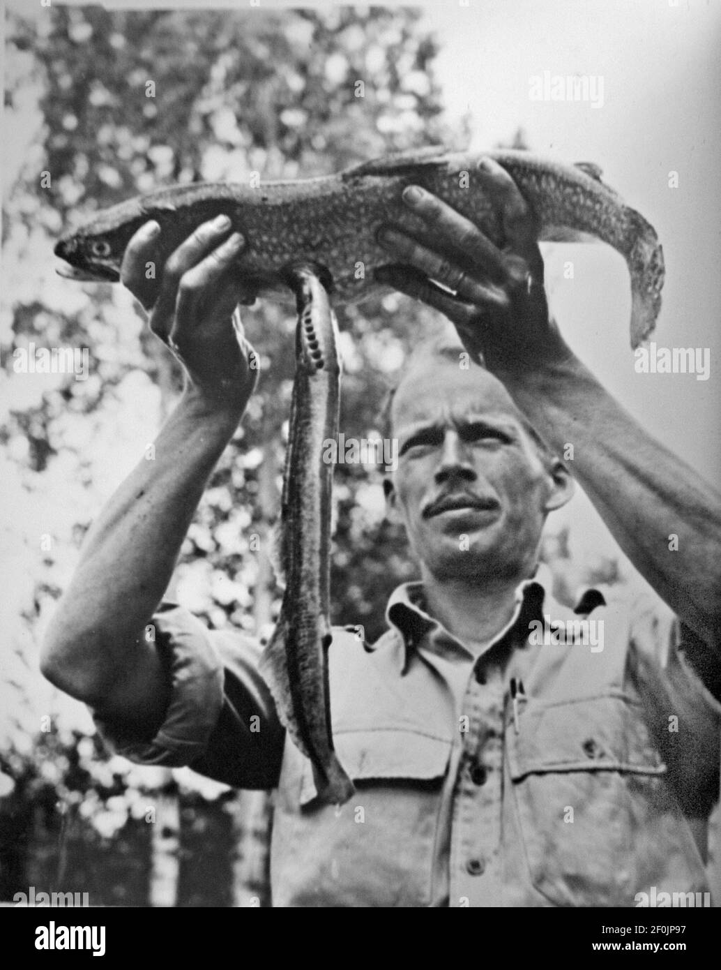 Vernon Applegate, who led the sea lamprey fight 50 years ago, holds one ...