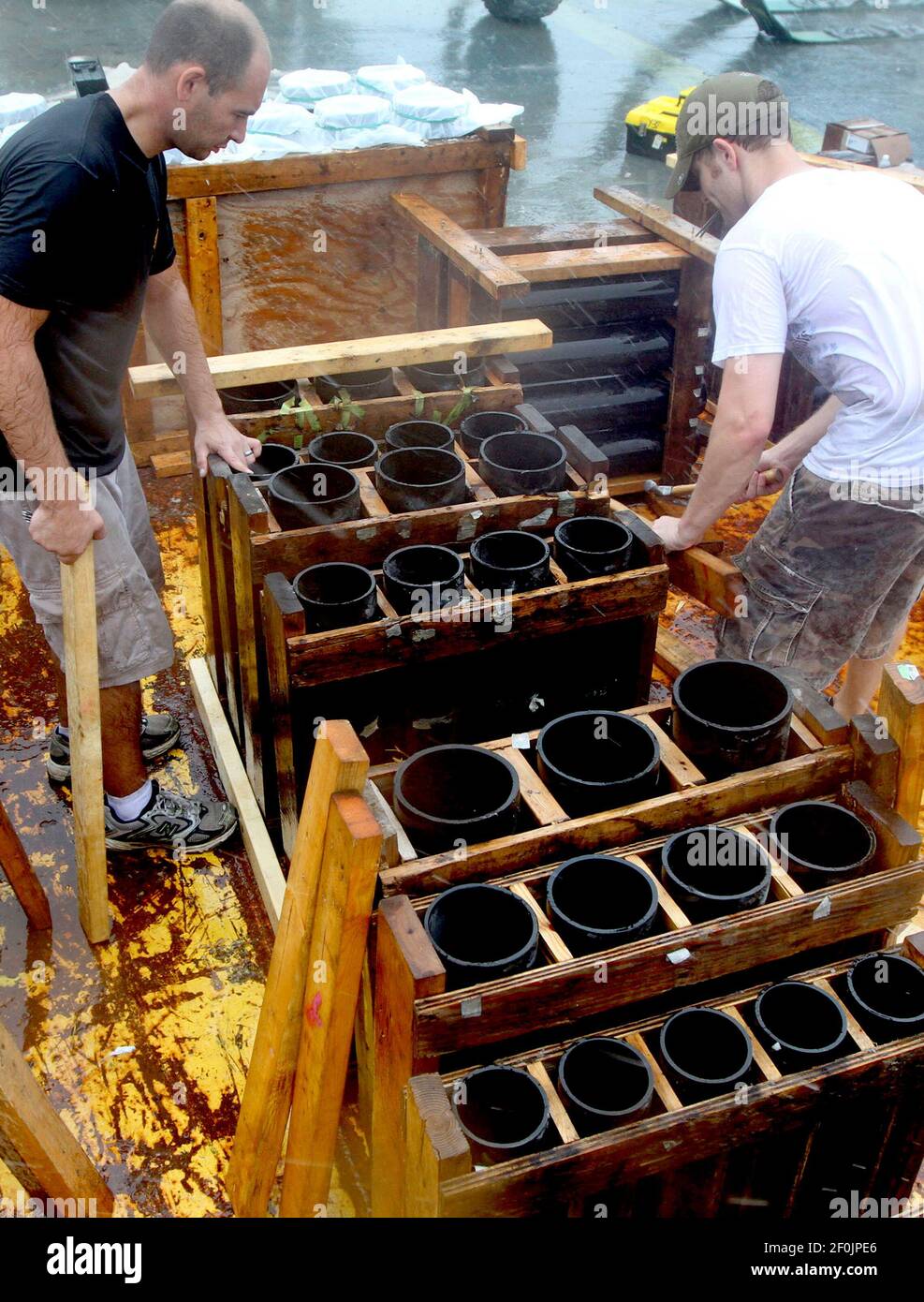 Luke Ryker, right, and Ryan Tennyson put together plywood on Thursday ...