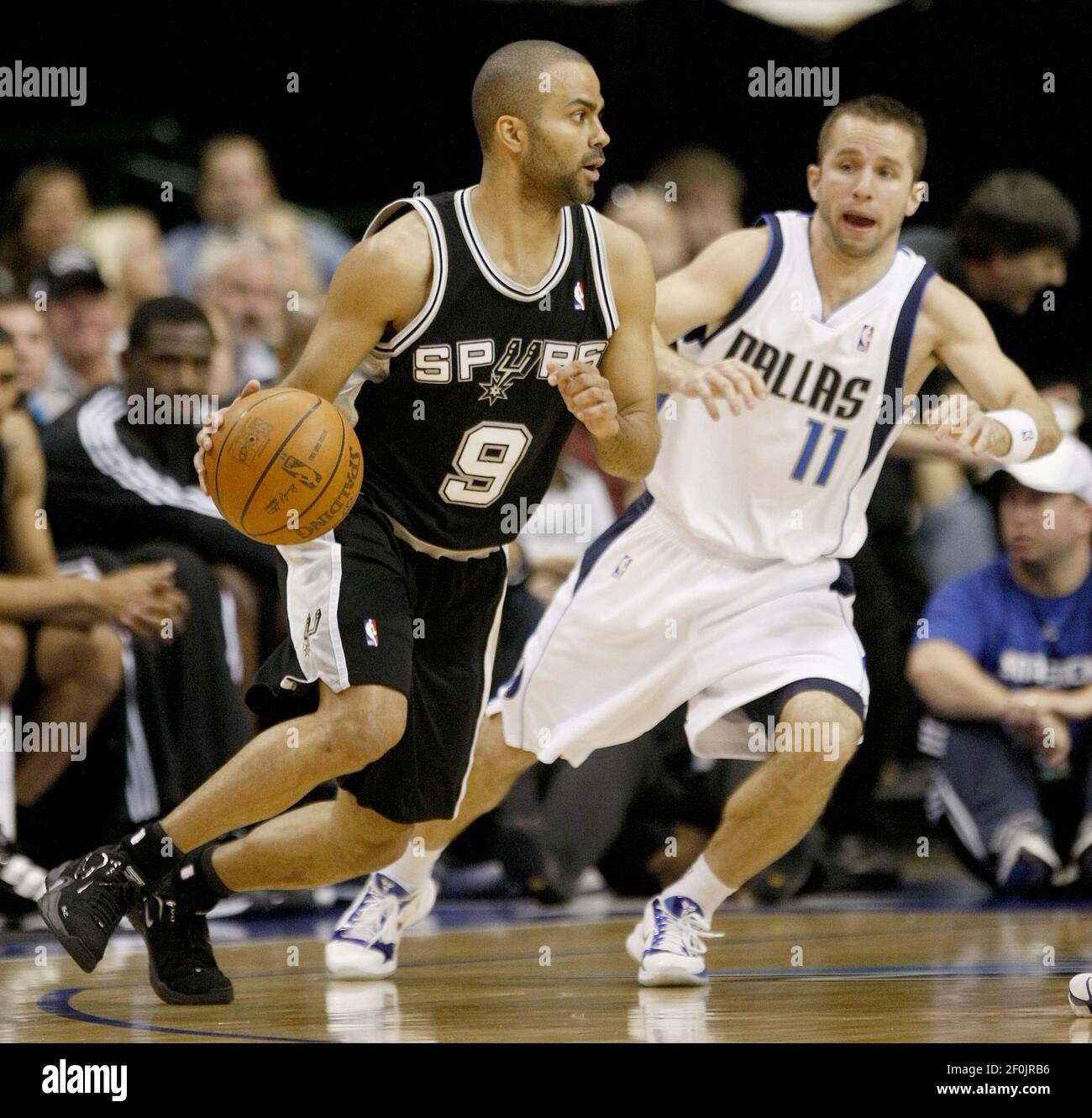Tony Parker of the San Antonio Spurs drives against Jose Juan Barea of ...