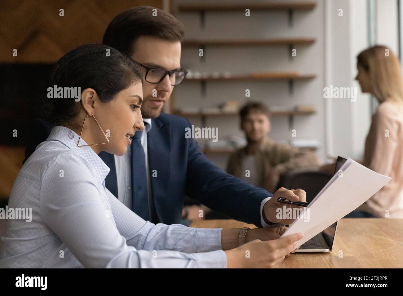 Two businesswoman working together documents hi-res stock photography ...
