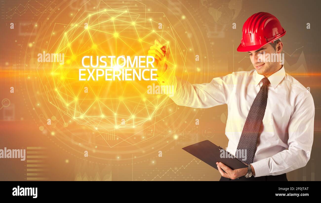 Handsome businessman with helmet drawing CUSTOMER EXPERIENCE ...