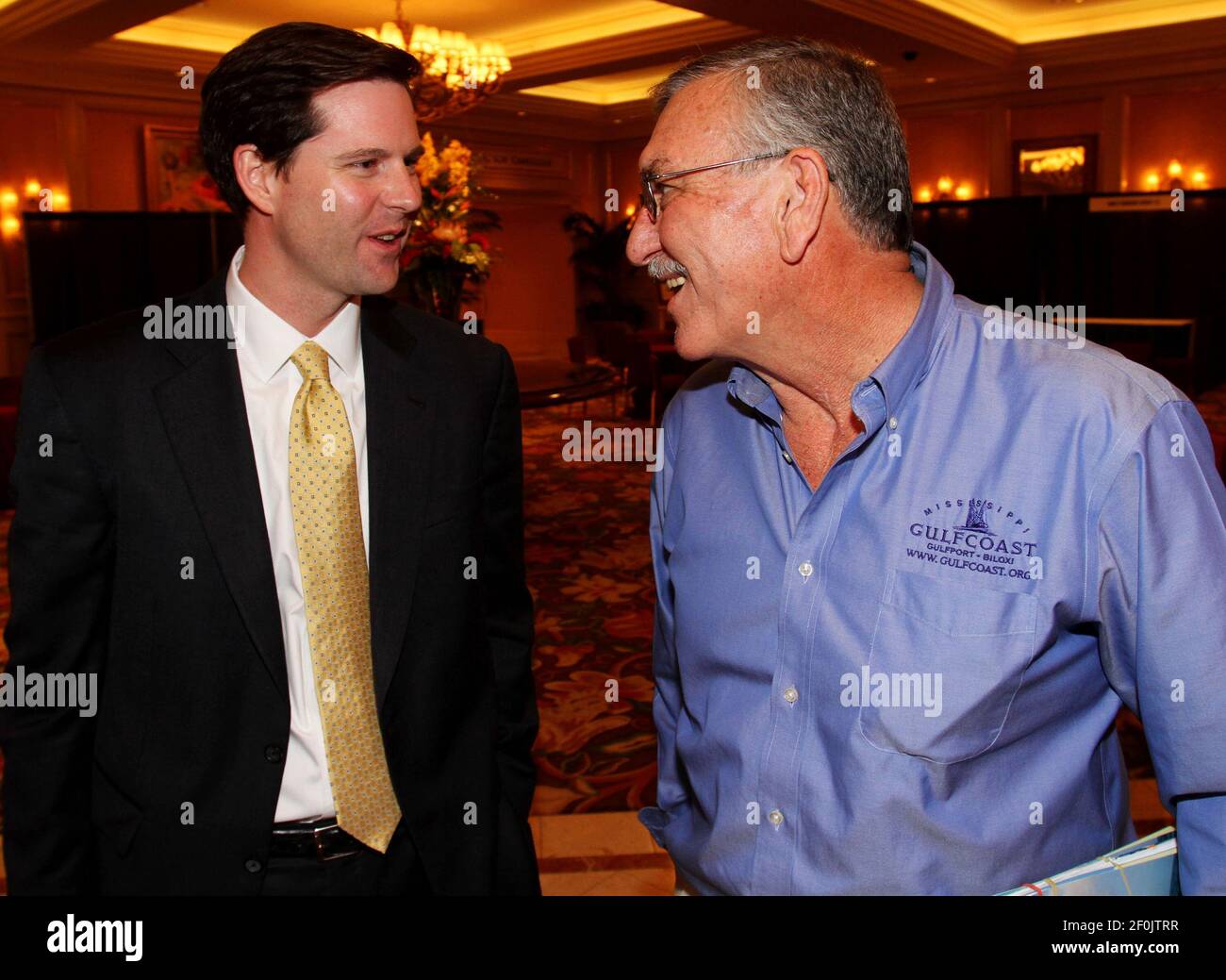 Jack Norris, director of the Gulf Coast Business Council, left, talks ...