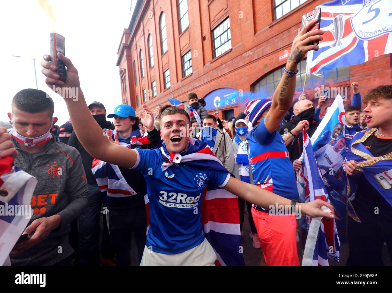 Rangers fans celebrate outside of the Ibrox Stadium after Rangers win ...