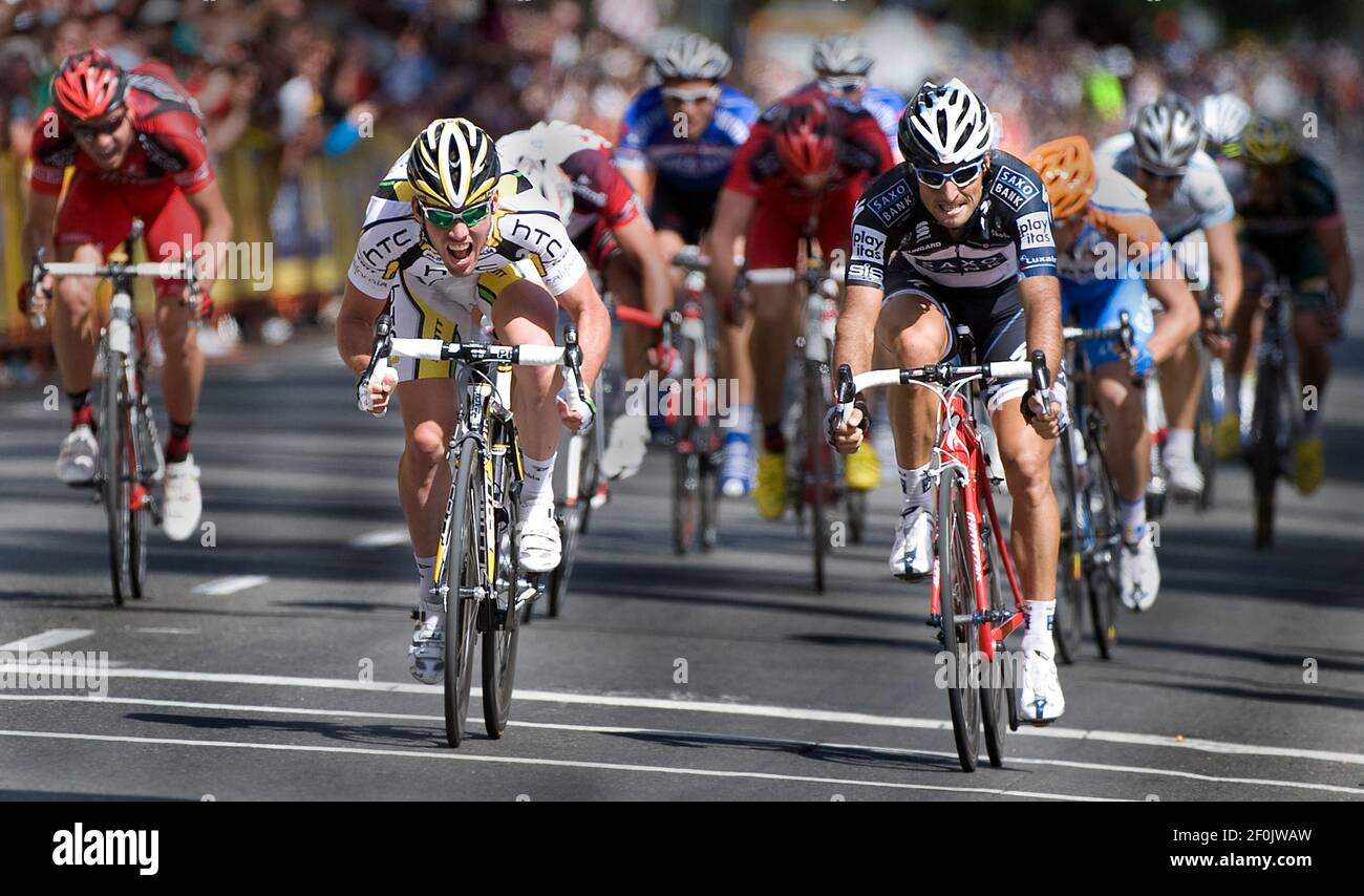 Mark Cavendish, left, and J.J. Haedo cross the finish line in the first ...