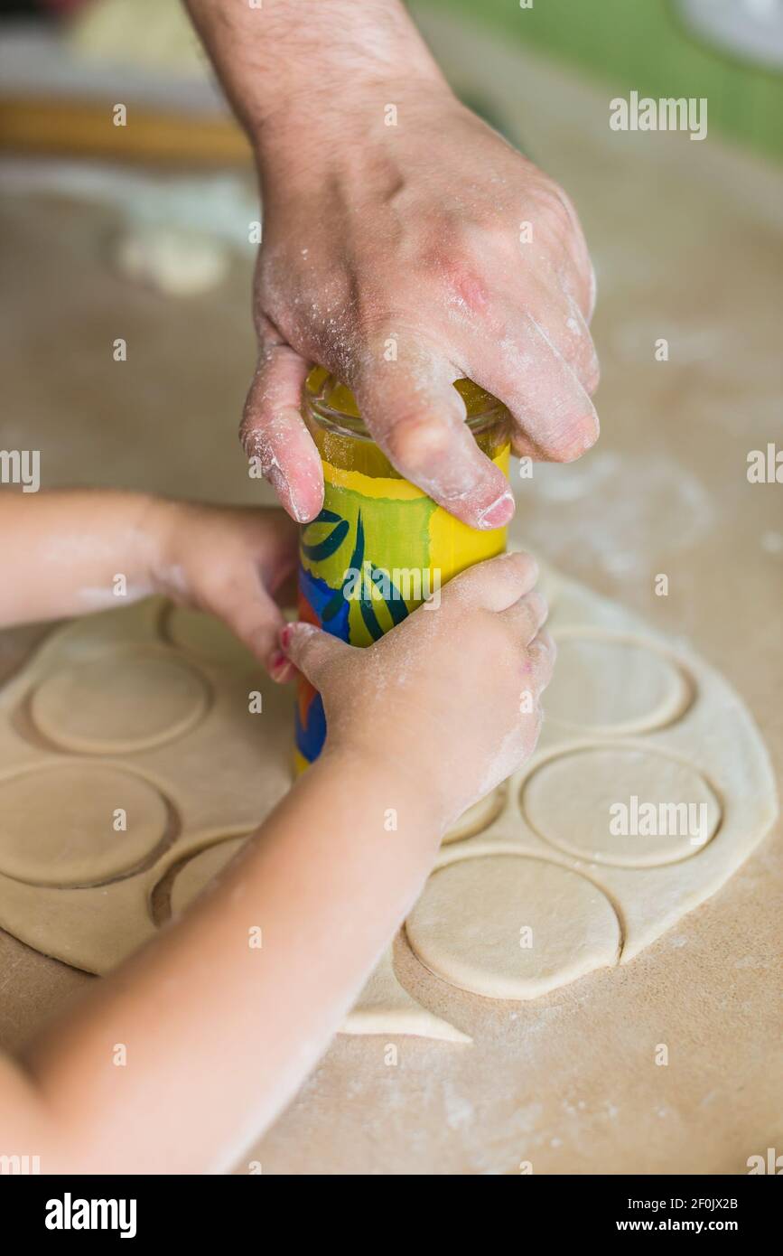 Children hands cook the circles of dough Stock Photo - Alamy