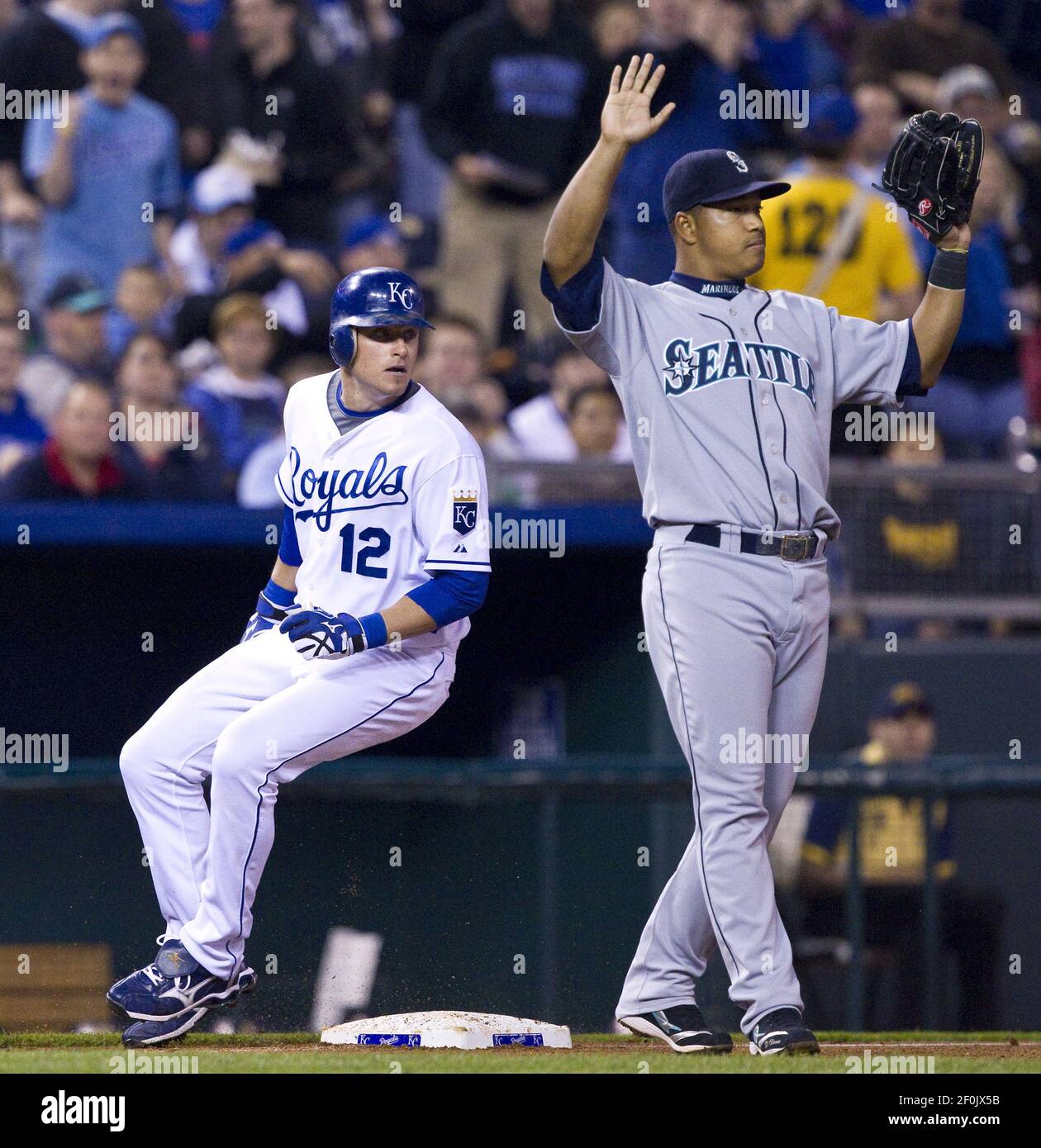 Kansas City Royals' Mitch Maier (12) holds up at third on an RBI triple ...