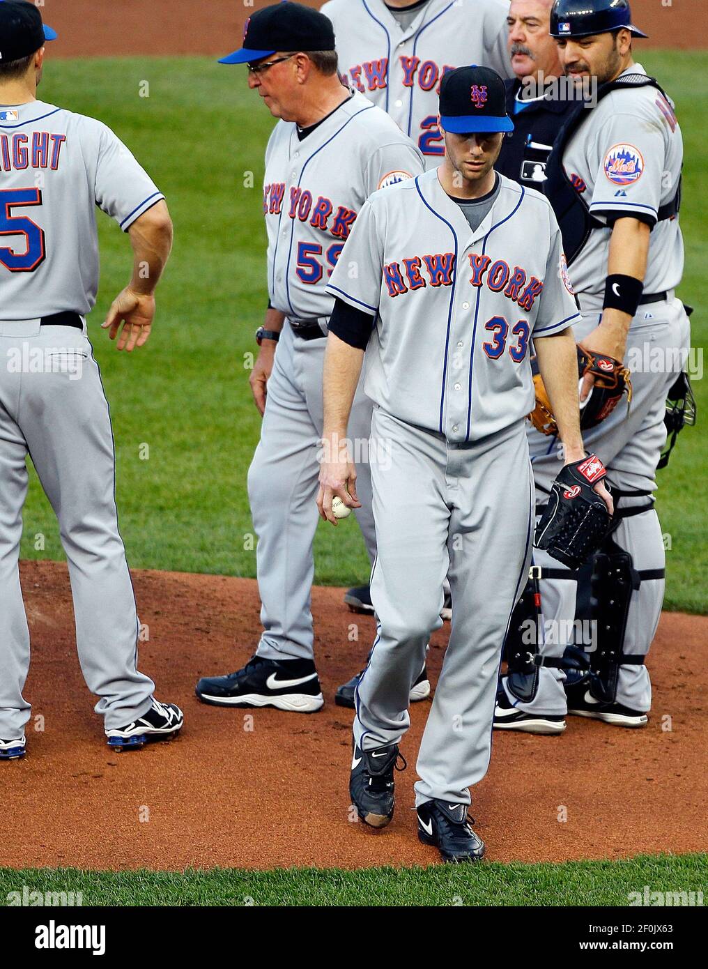 New York Mets' John Maine (33) leaves the mound and game after being ...
