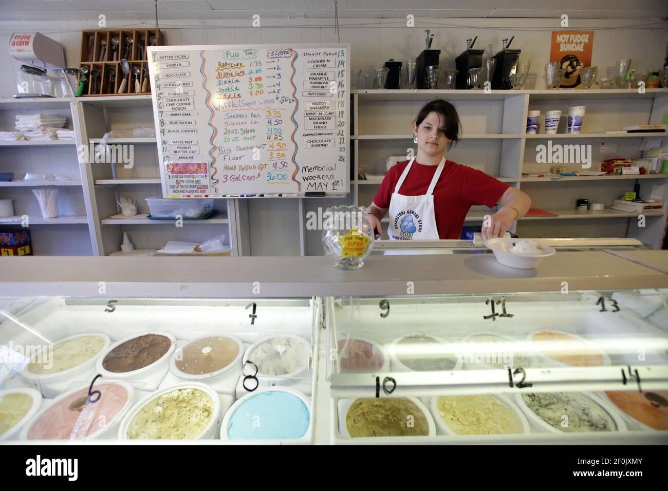 Sheila Mosey, from Port Austin, dishes out ice cream at the Grindstone ...