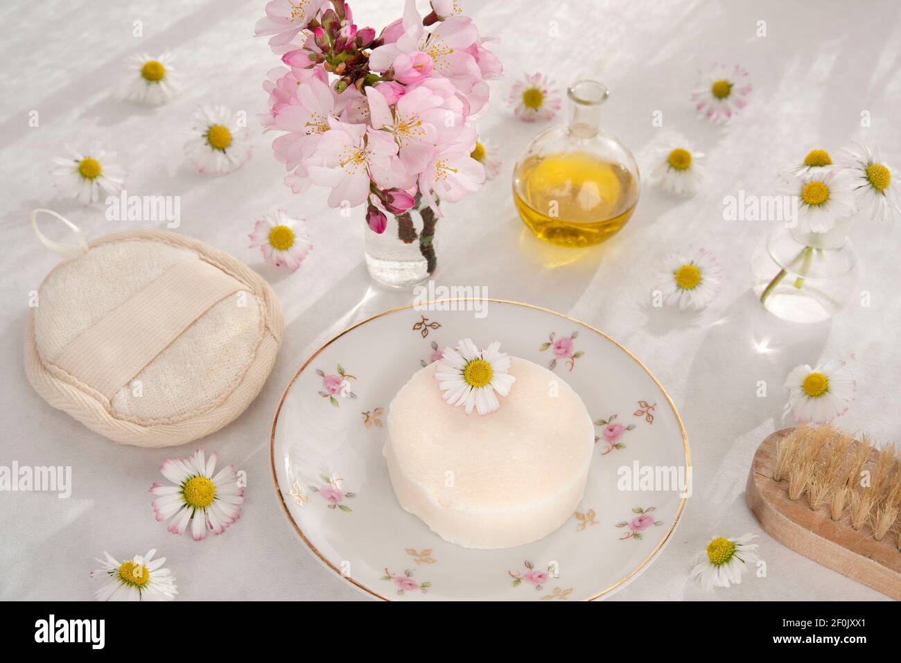 Homemade soap or shampoo with oil and flowers on the side Stock Photo ...