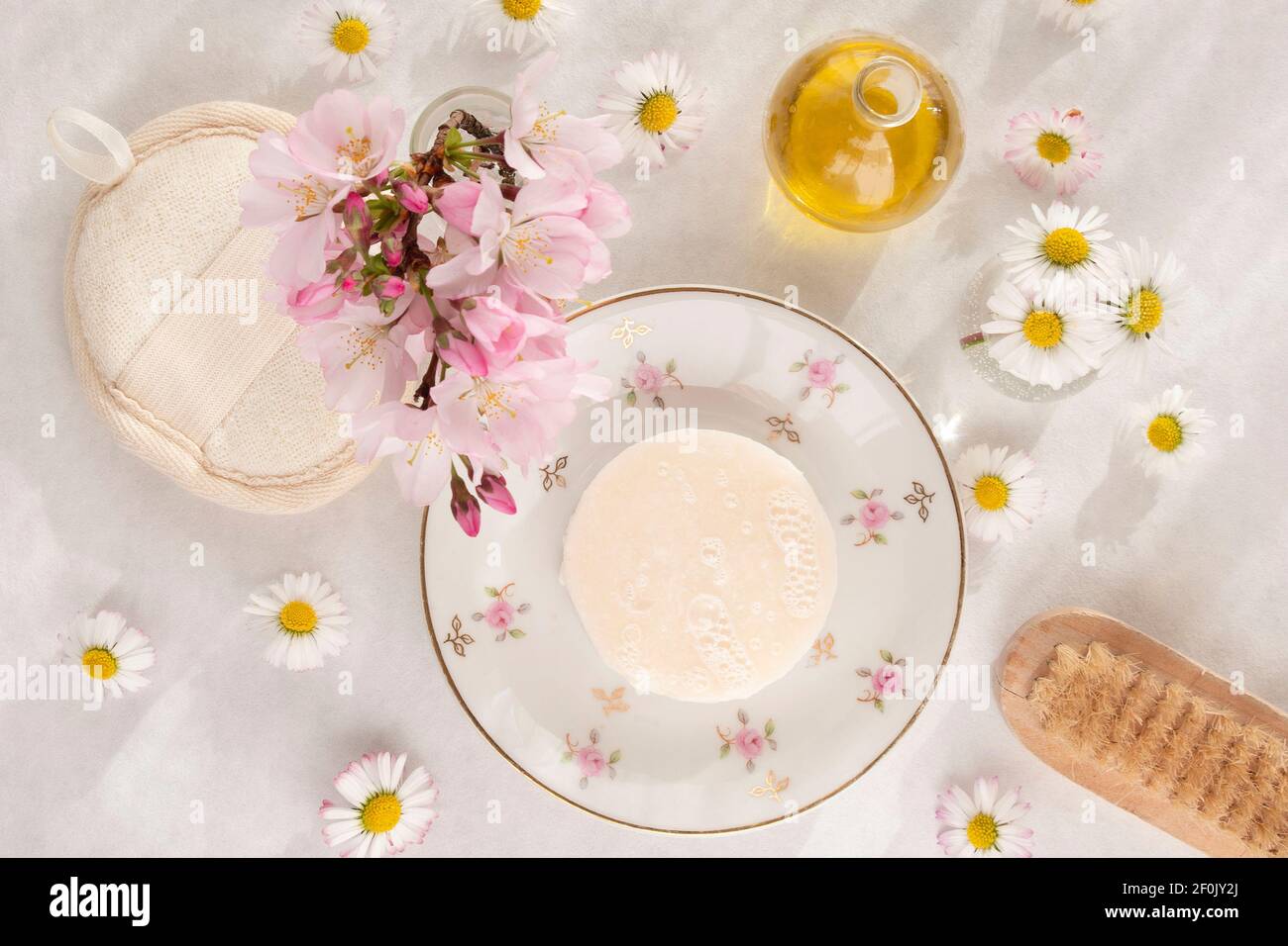 Homemade soap or shampoo with oil and flowers on the side Stock Photo ...