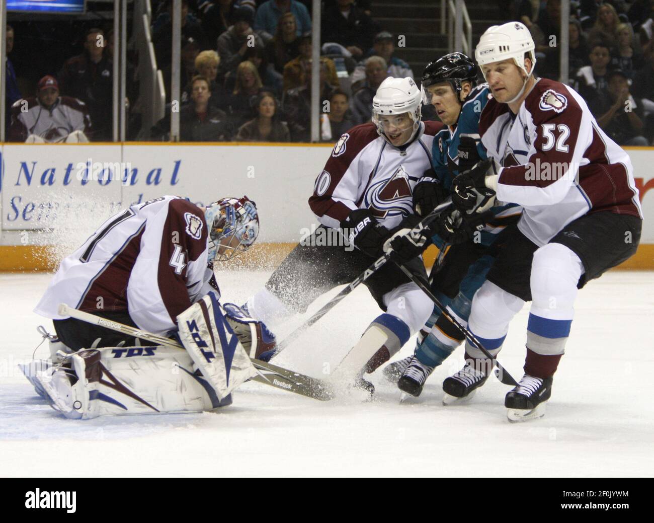 Colorado Avalanche goalie Craig Anderson, left, makes a stop in front ...