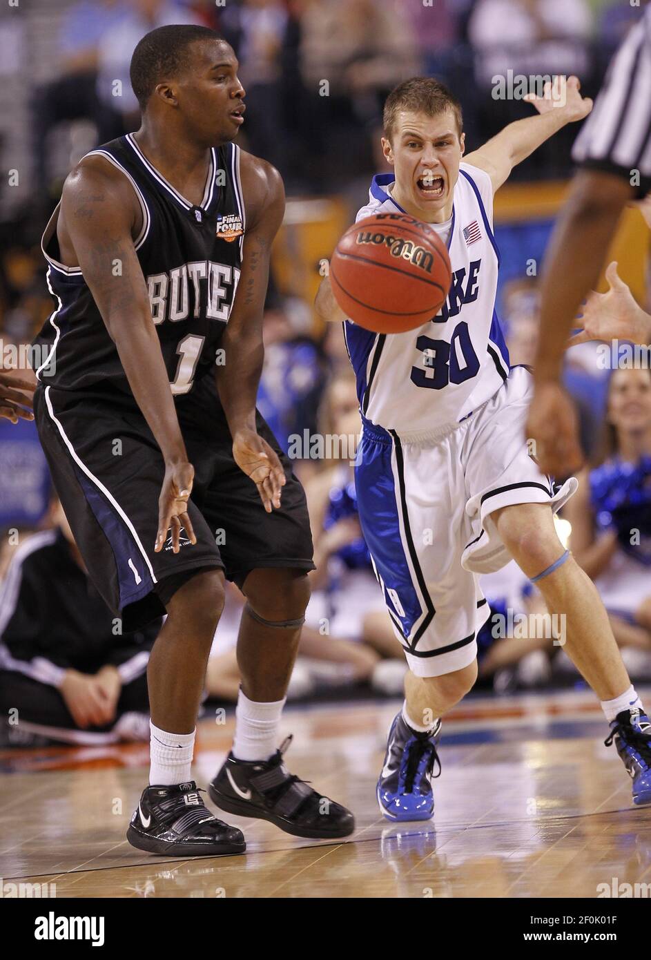 Jon Scheyer of Duke (30) grabs for a loose ball against Shelvin Mack of ...