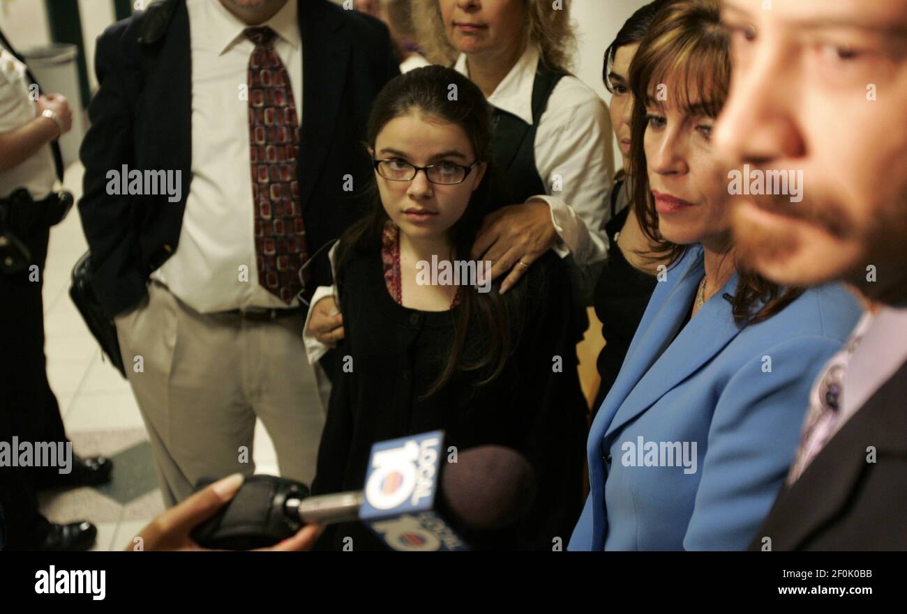 Kayla Manson, surrounded by her family and attorneys during an ...