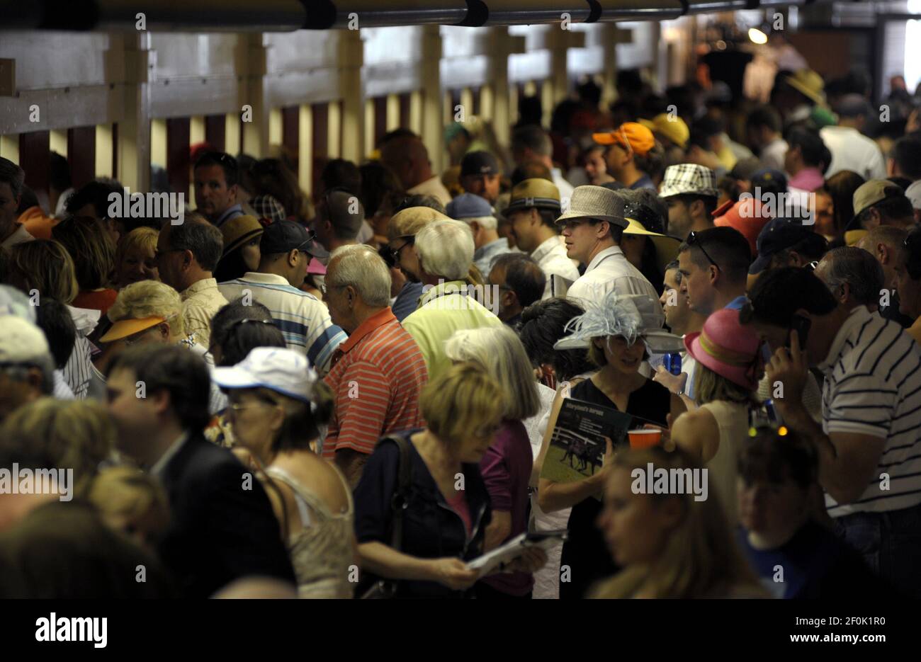 Bettors line up to wager prior to the 135th running of the Preakness ...