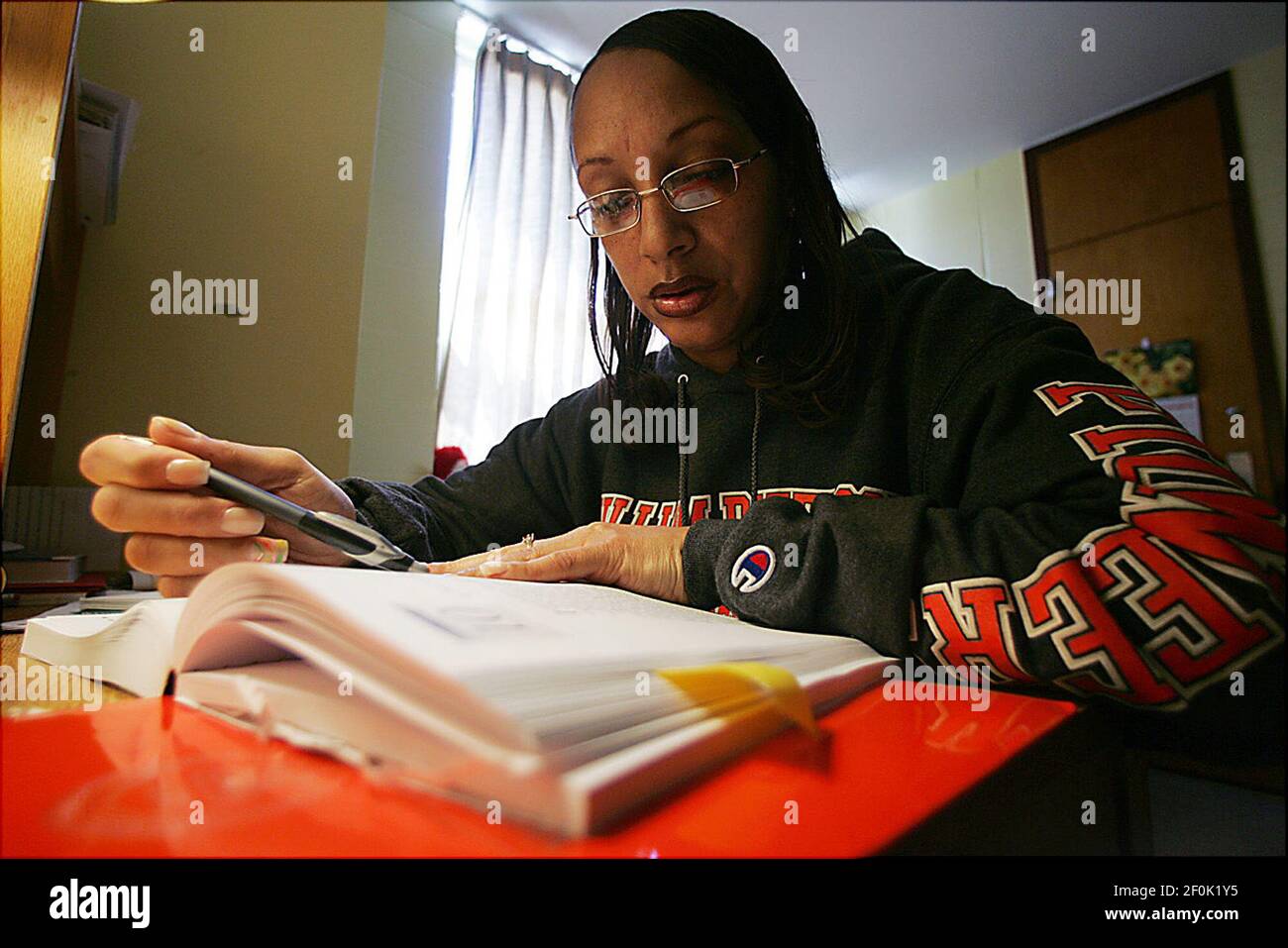 Demetria Washington works on her Writing 101 homework in her dorm room ...