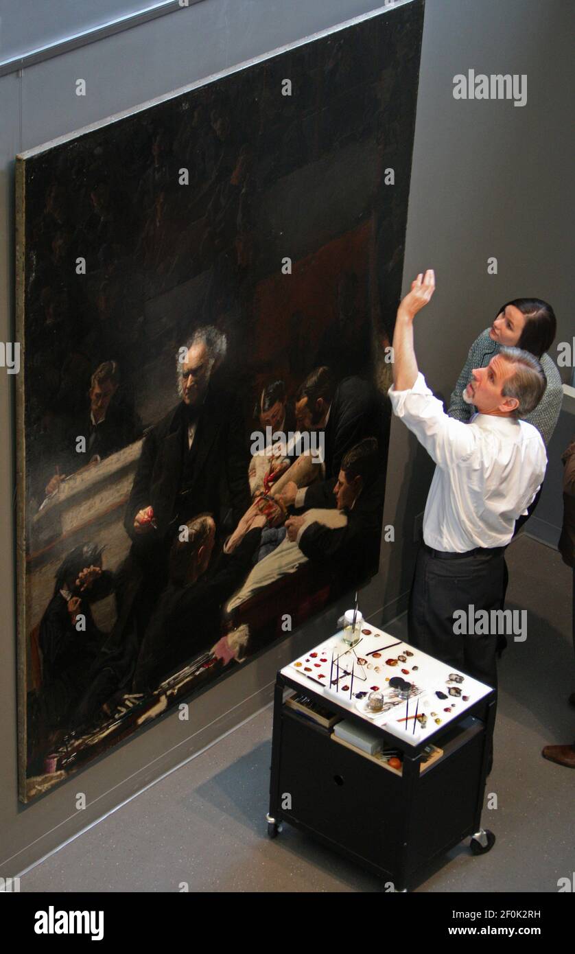 Mark Tucker, left, and Anna Marley work on the restoration of the ...