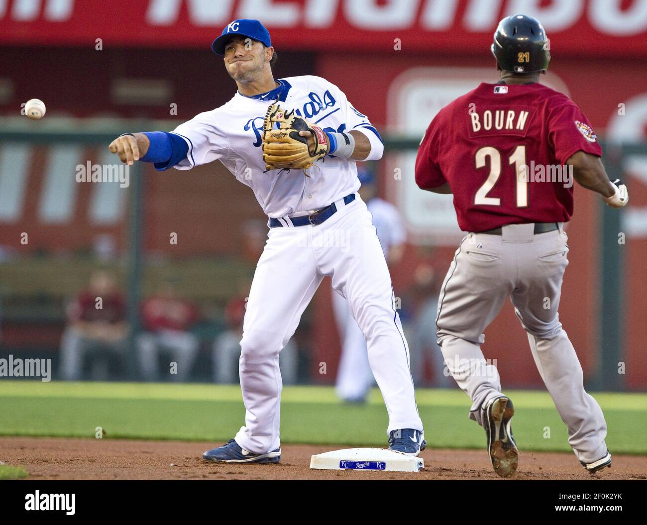Kansas City Royals second baseman Mike Aviles competes the double play ...