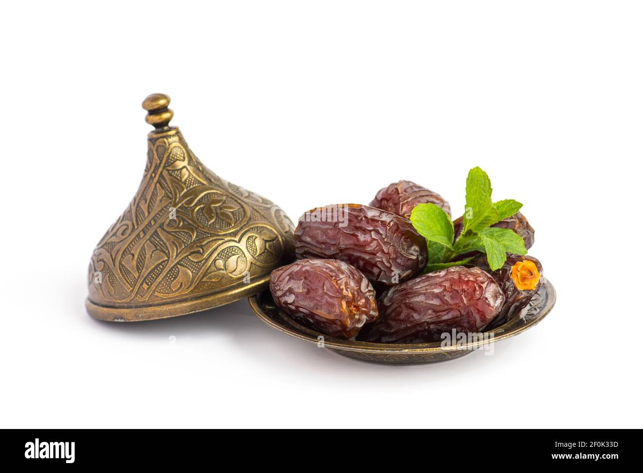 HURMA, Dates. Dried dates fruit with bronze bowls on white background ...
