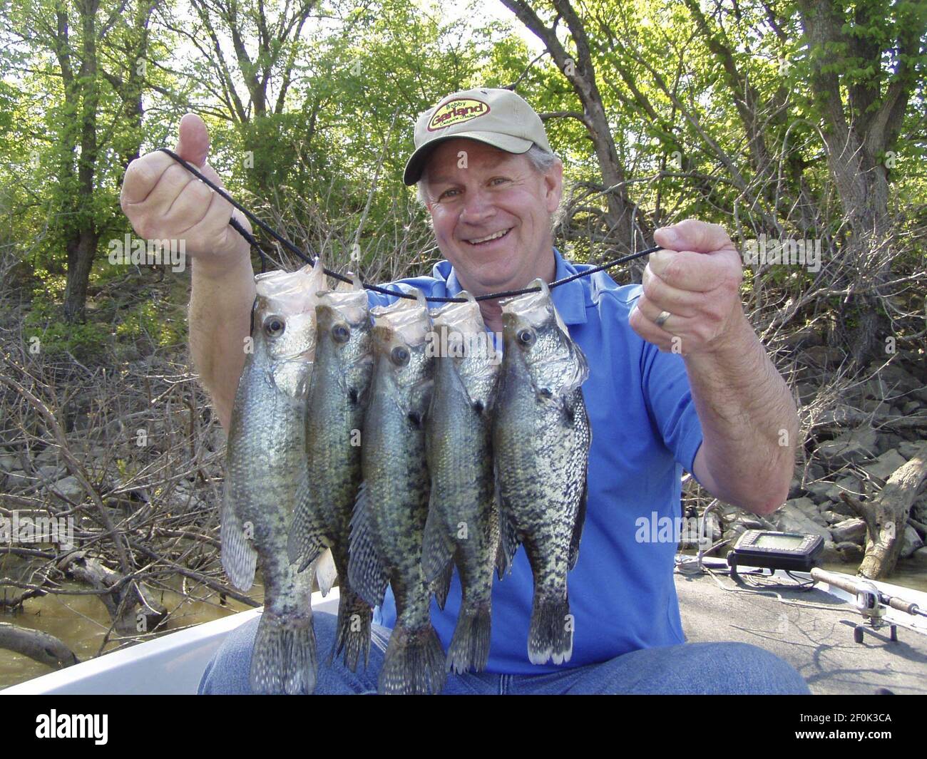 Gary Dollahon displays a stringer of crappies caught at Lake Eufaula in ...