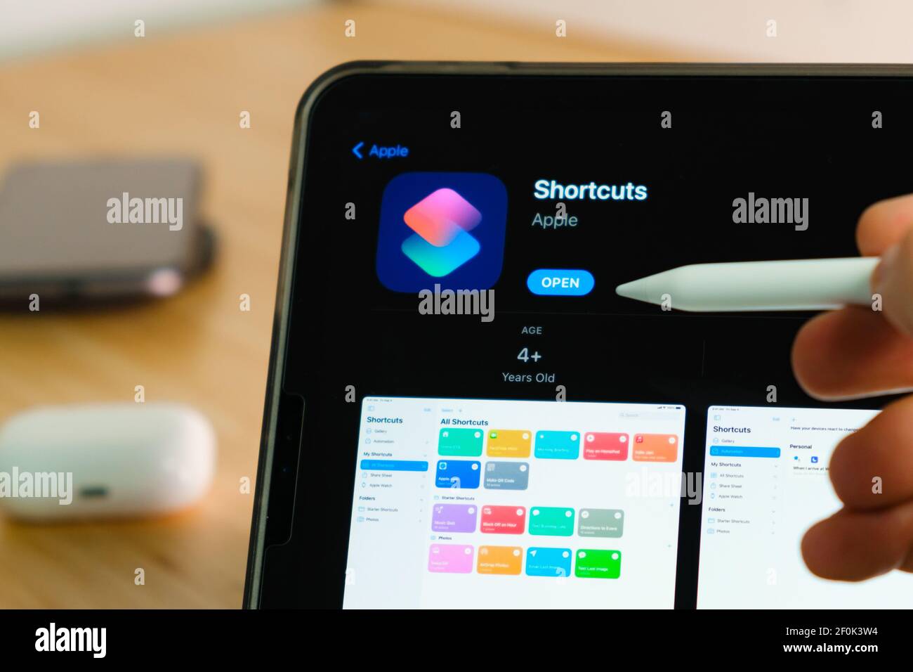Apple Shortcuts logo shown by apple pencil on the iPad Pro tablet ...