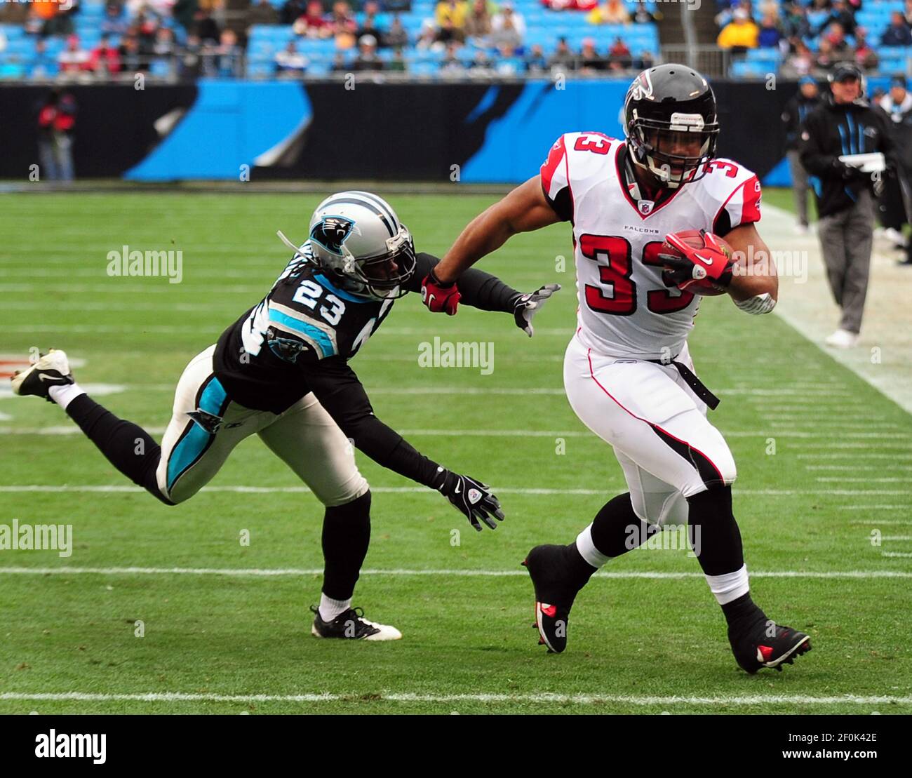 Carolina Panthers safety Sherrod Martin (23) is unable to grab a hold ...