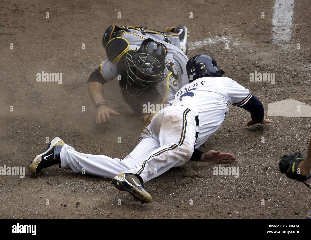 Milwaukee Brewers' Jim Edmonds is tagged out by Pittsburgh Pirates ...