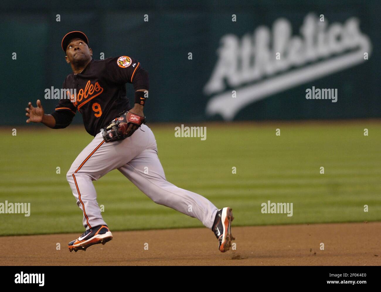 Miguel Tejada of the Baltimore Orioles chases down a foul ball against ...