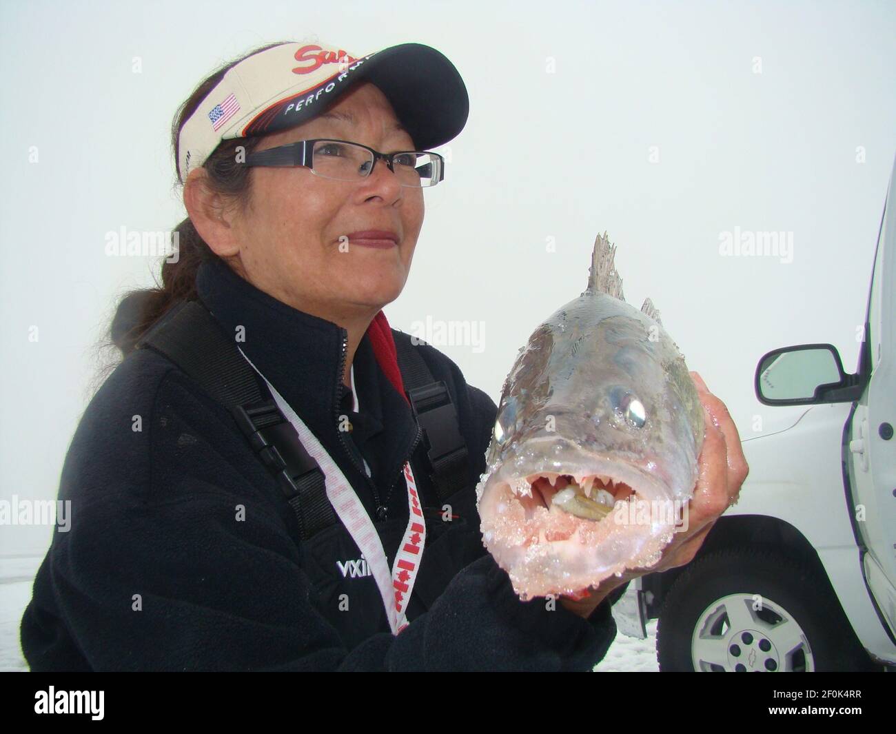 Fishing guide Holly Chow holds a "greenback" walleye on March 14, 2010 ...