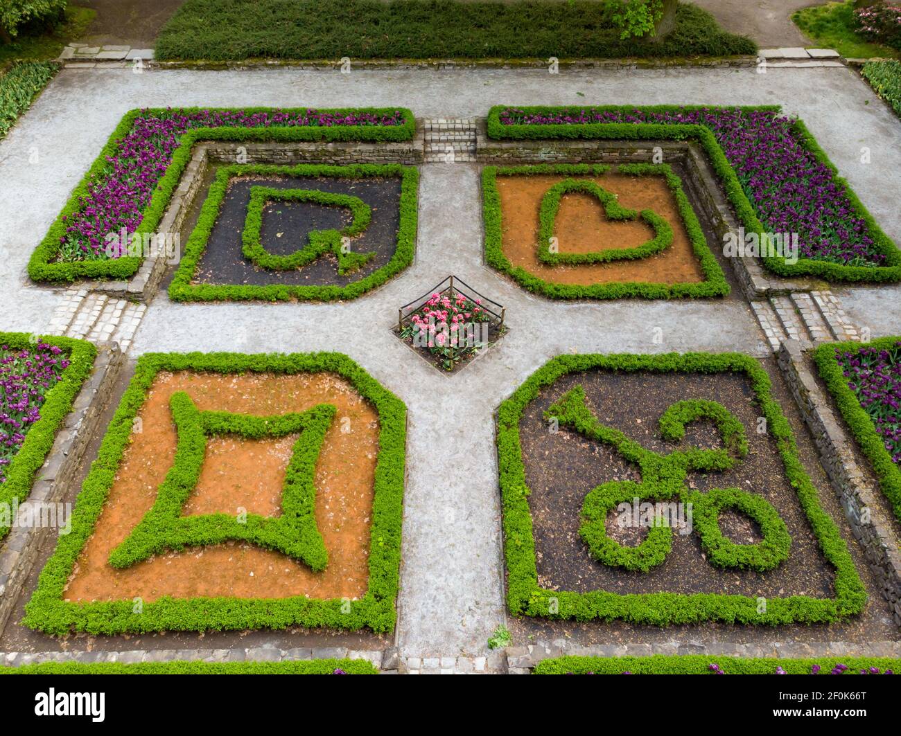 Aerial drone look to Small square in park with plants in card symbols ...