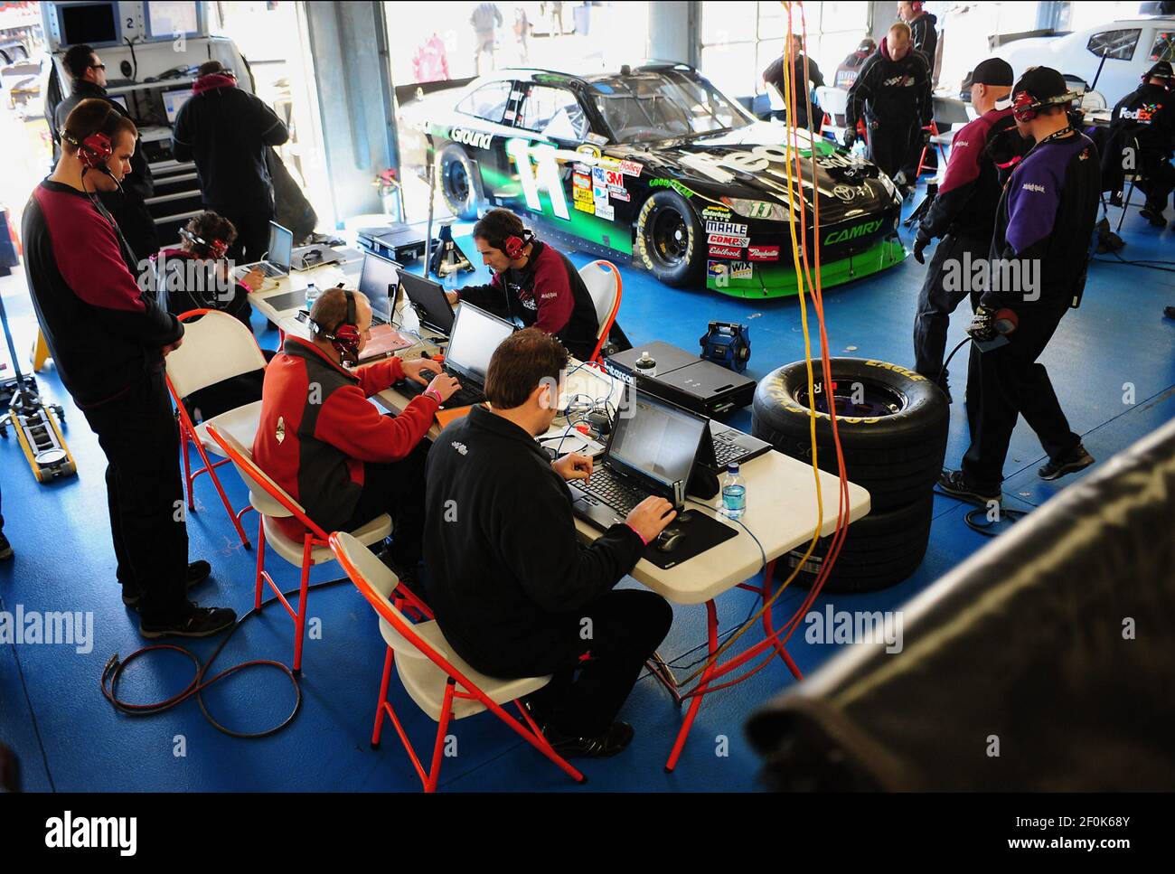 Crew members analyze data as NASCAR Sprint Cup Series driver Denny ...