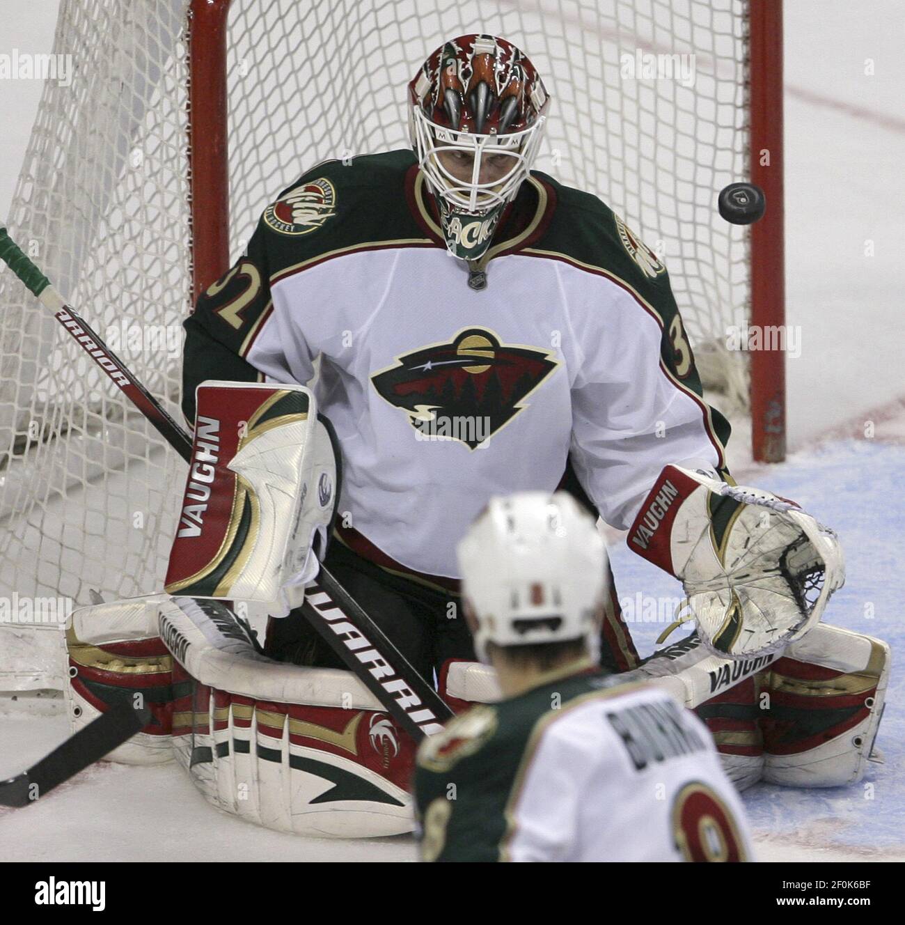 Minnesota Wild's goalie, Niklas Backstrom, keeps a close eye on the ...