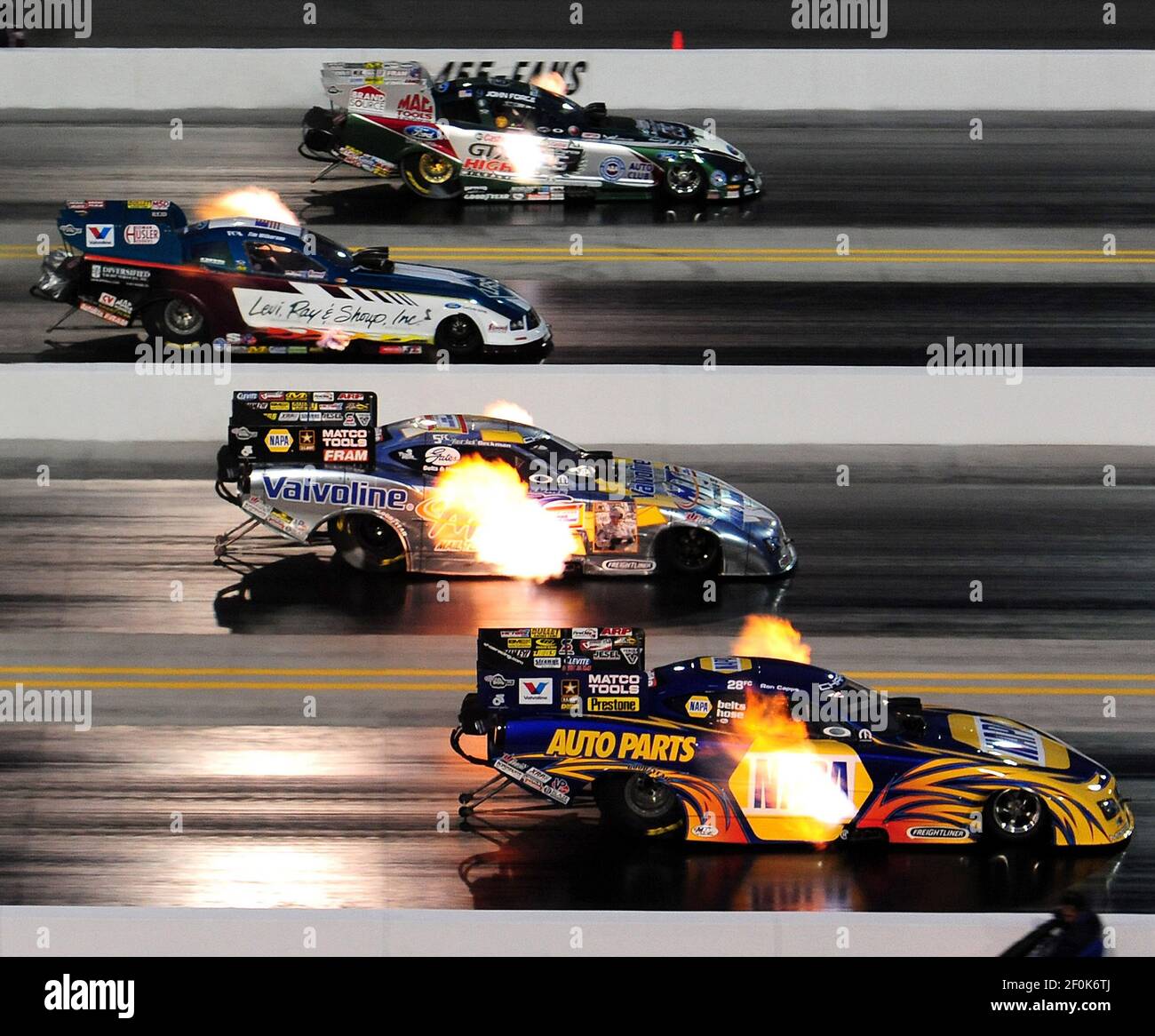 Funny car drivers cars race four-wide at zMax Dragway in Concord, North ...