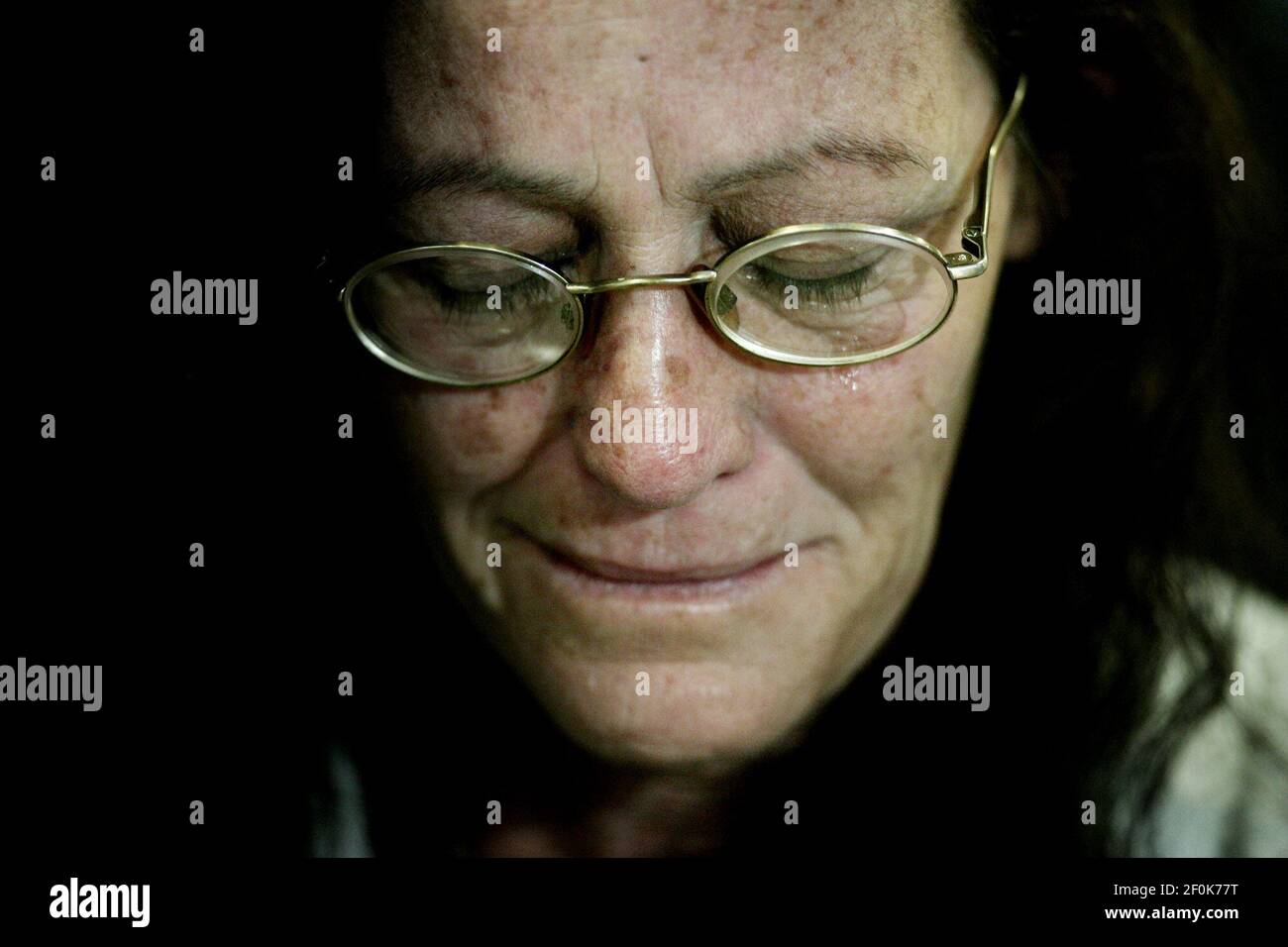 Donna Powers, foreground, mother of Wayne Treacy, 15, gets emotional ...