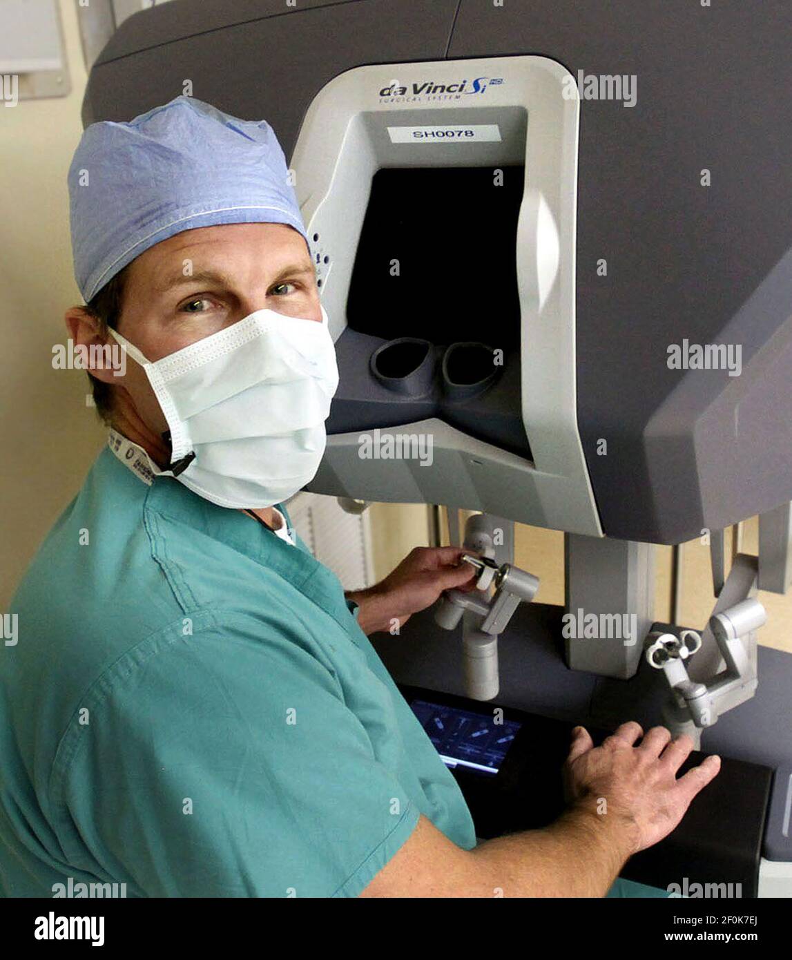 Dr. Mark Dylewski, a thoracic surgeon, looks up for a moment from the ...