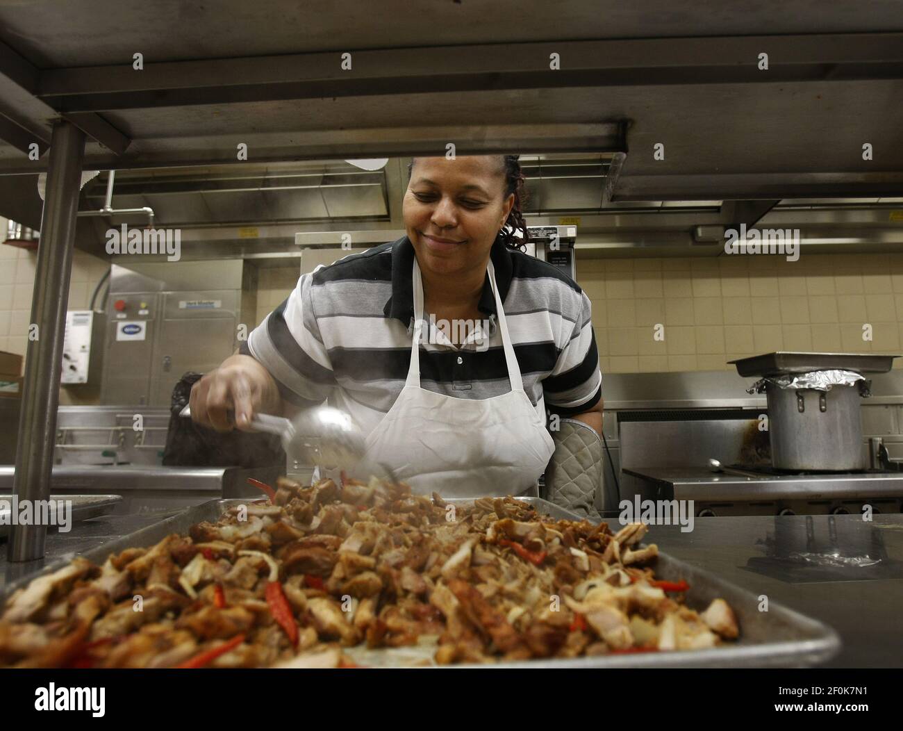 Wanda Slaughter, food service manager, turns over a chicken stir-fry ...