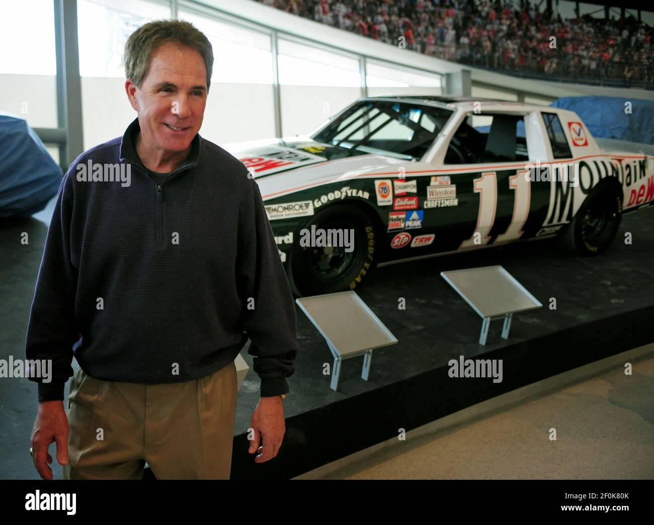 Former NASCAR driver Darrell Waltrip talks with members of the media ...