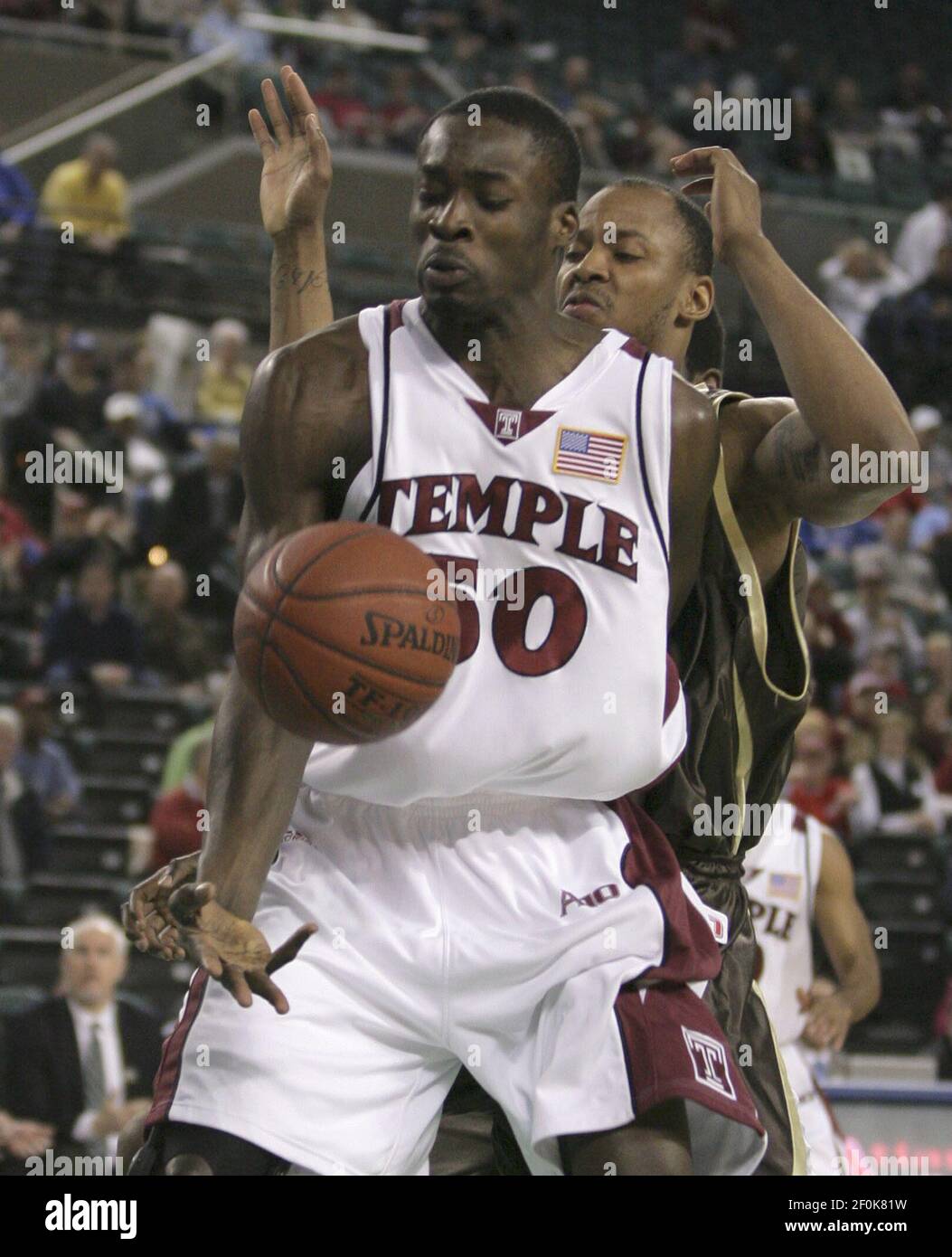 Temple's Micheal Eric (50) tries to control the basketball against St ...