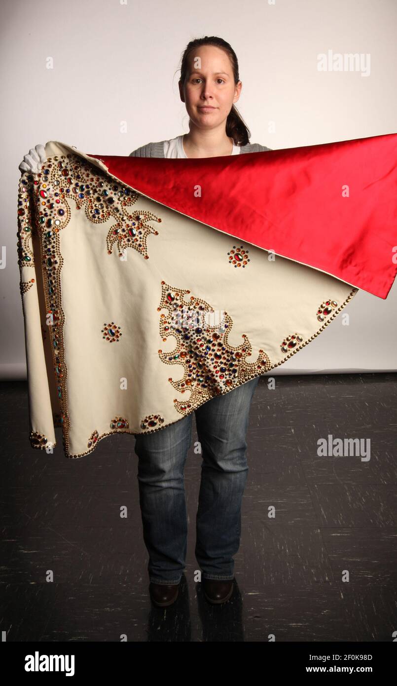 Danielle Forbes displays a cape worn by Elvis Presley that is part of ...