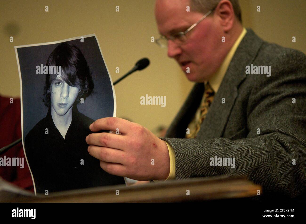 Matt Masterson of Virginia Beach, Va., holds a photo of his son Evan ...