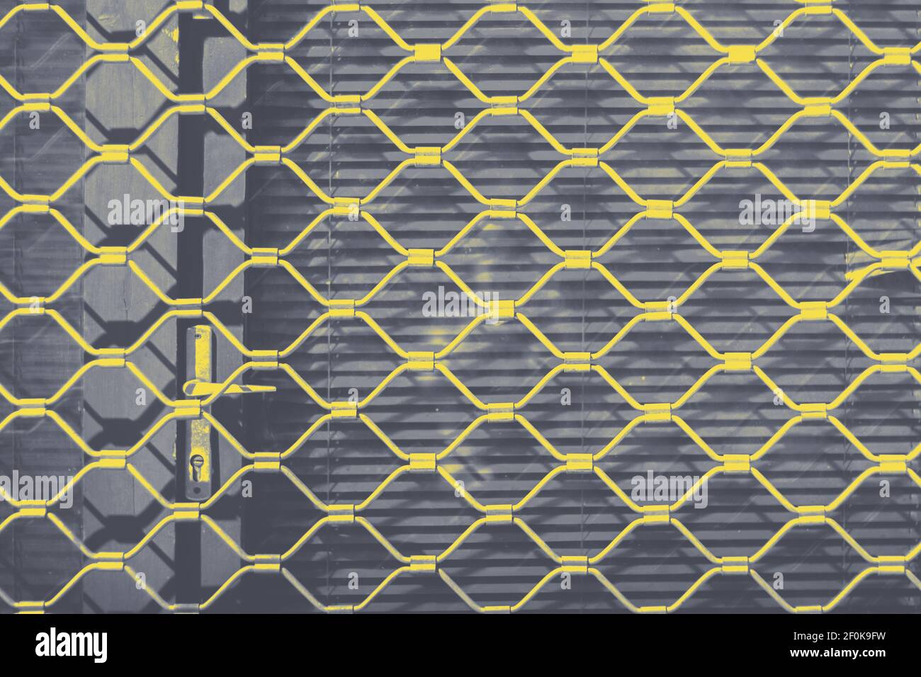 Iron texture of a steel grill on shutters on the door. Grey background ...