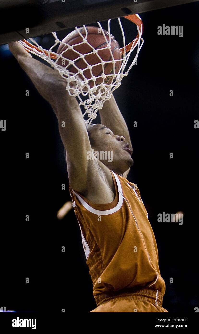 Texas guard Jai Lucas (10) followed up with a dunk in the first half of ...
