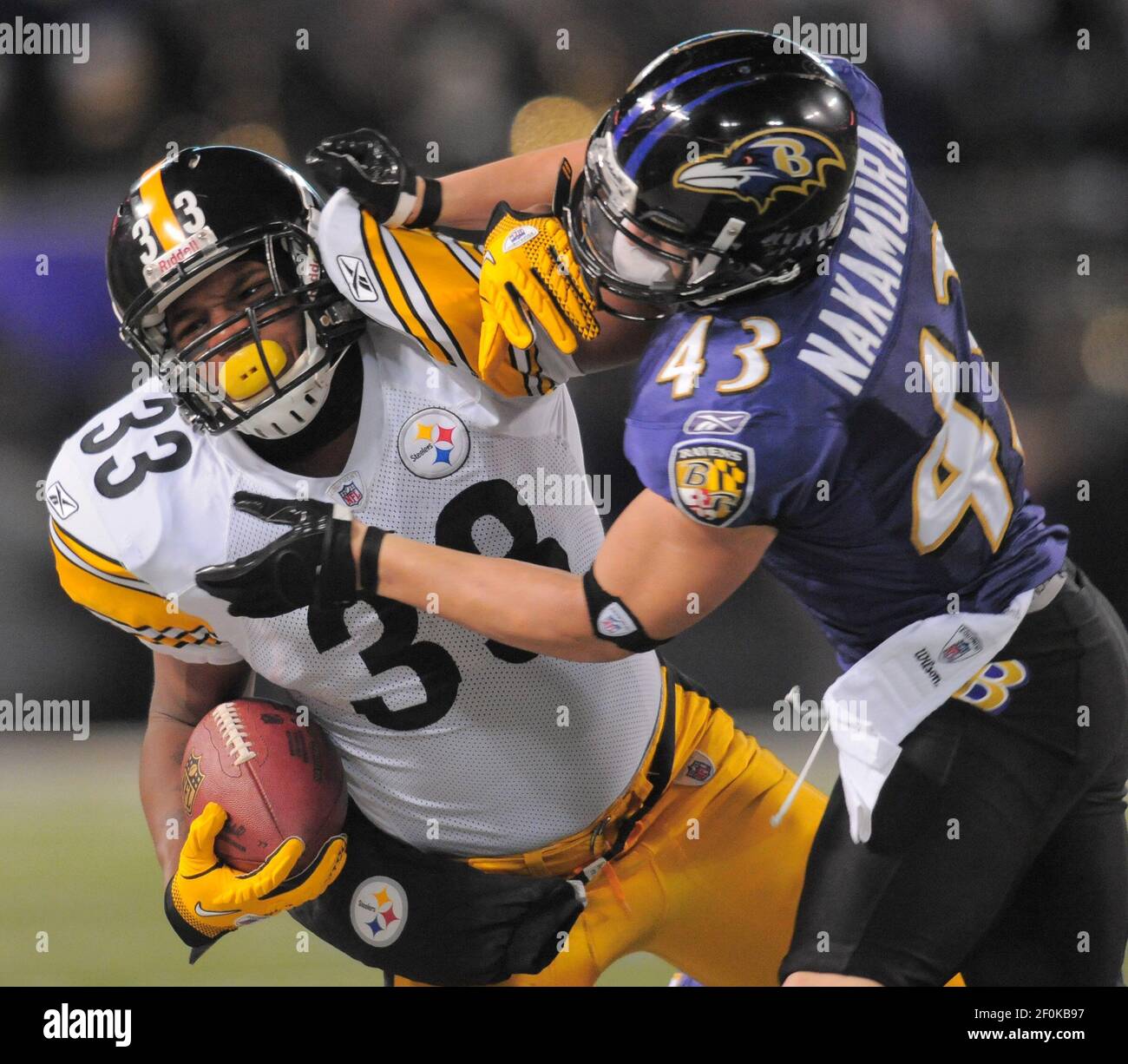 Pittsburgh Steelers running back Isaac Redman pushes Baltimore Ravens ...