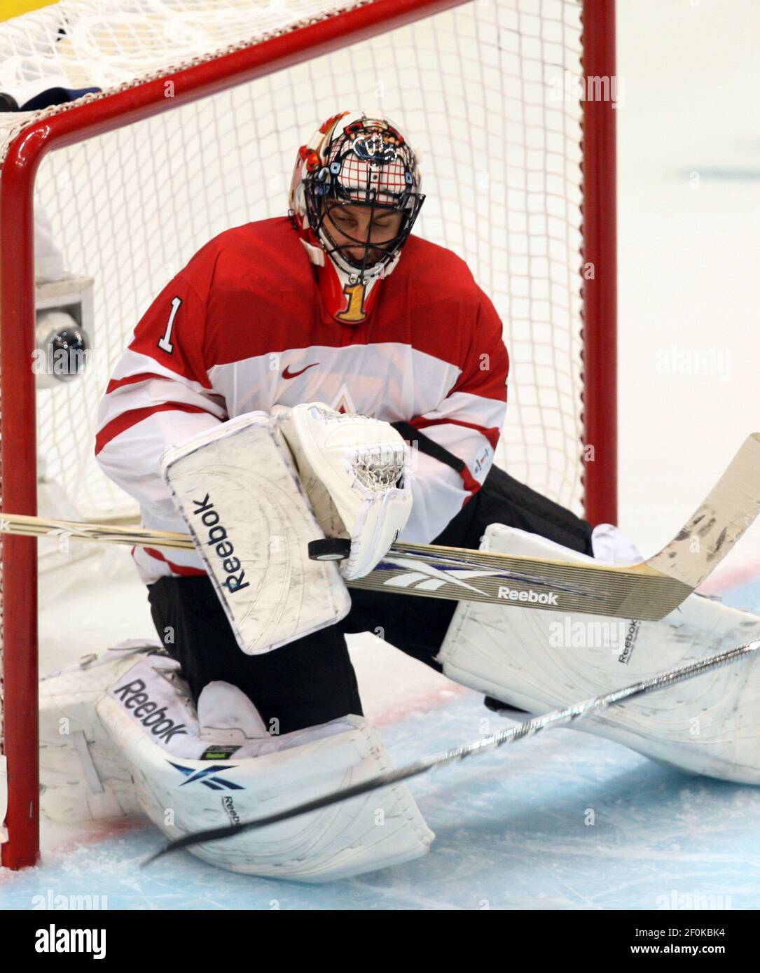 Canada's Roberto Luongo (1) stops a shot by the United States in the ...
