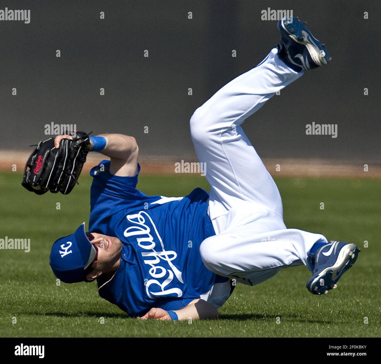 Kansas City Royals willie Bloomquist takes a tumble while chasing a fly ...