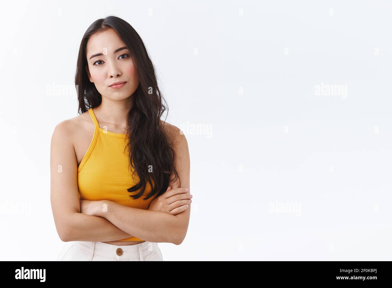 Skeptical and unimpressed serious-looking, determined young asian ...