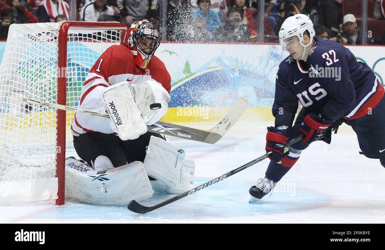 Canada goalie Roberto Luongo, left, makes the save as USA's Dustin ...