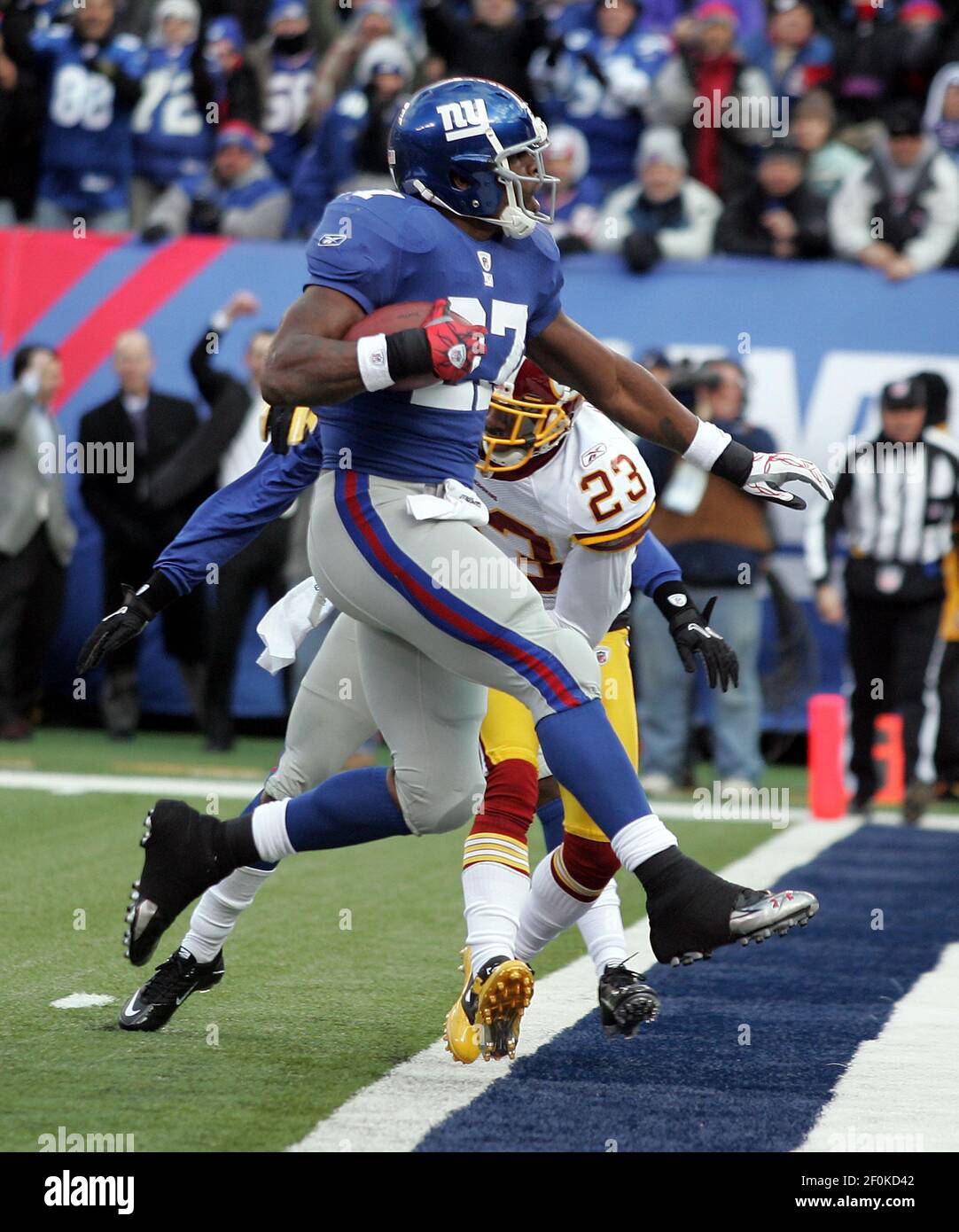 New York Giants running back Brandon Jacobs (27) leaps across the line ...