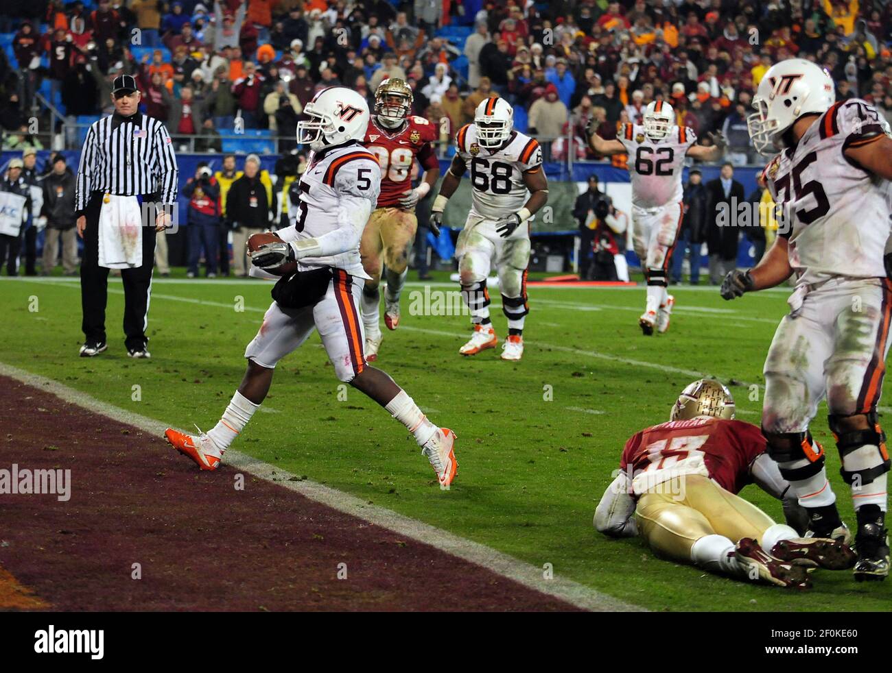 Virginia Tech quarterback Tyrod Taylor (5) walks into the end zone for ...