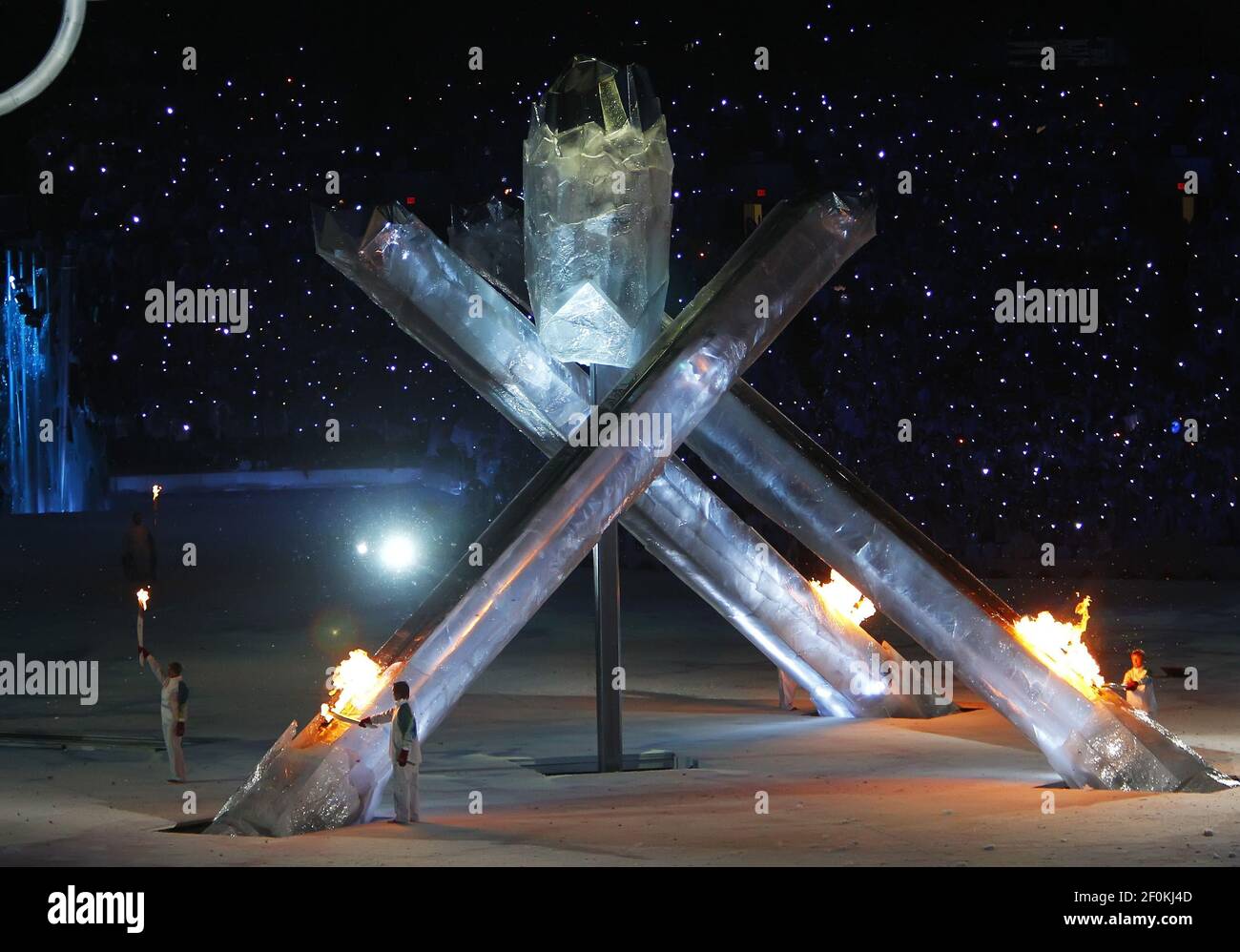The Olympic Torch is lit during the Opening Ceremonies of the 2010 ...
